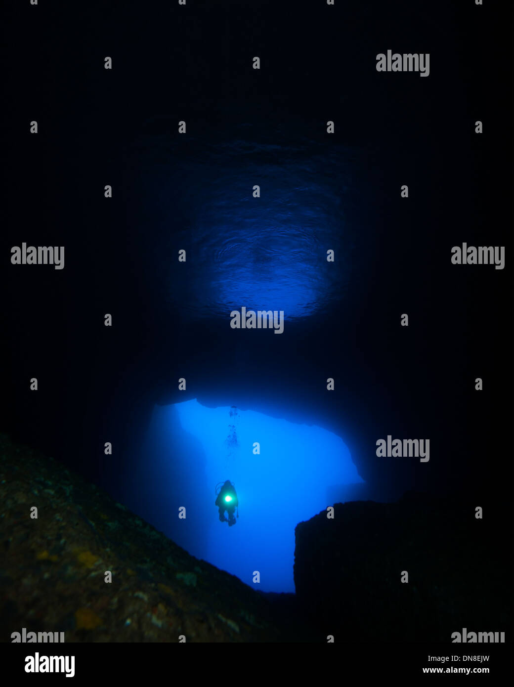 Scuba diver in a cave at Reqqa point in Gozo, Europe Stock Photo - Alamy