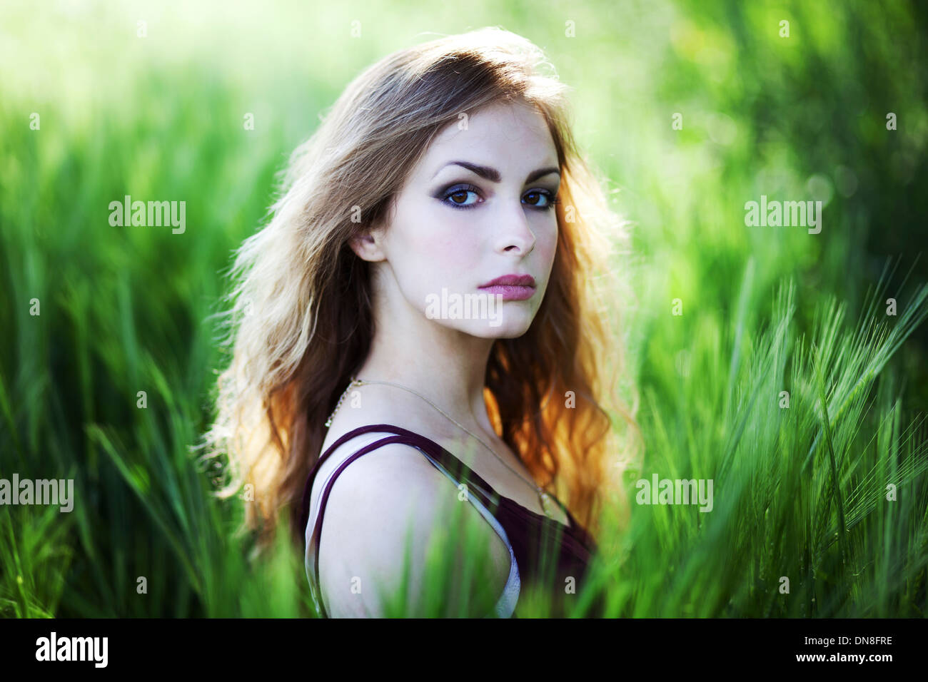 Sad woman looking at camera outside hi-res stock photography and images ...