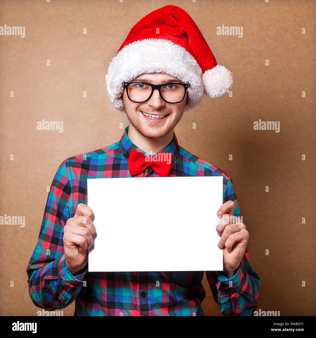 Hipster Santa Claus pointing in white blank sign with smile, isolated ...