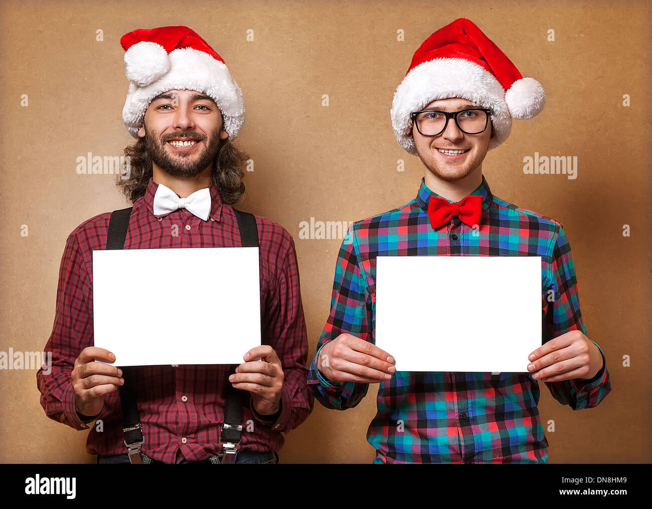 Christmas, x-mas, people, advertisement, sale concept - happy two man ...