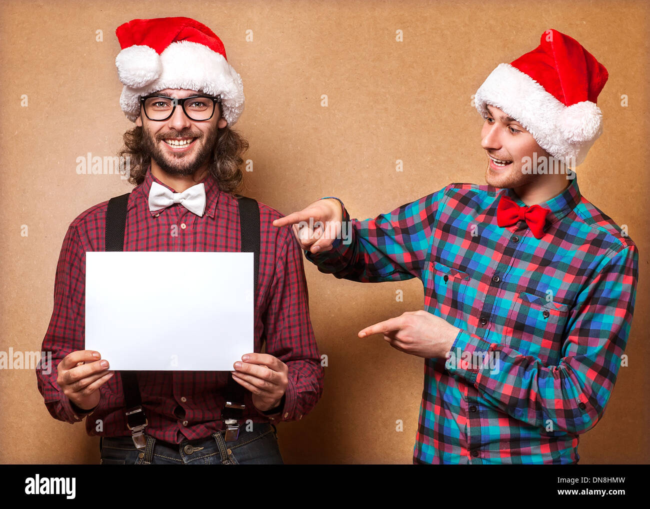 Christmas, x-mas, people, advertisement, sale concept - happy two man ...