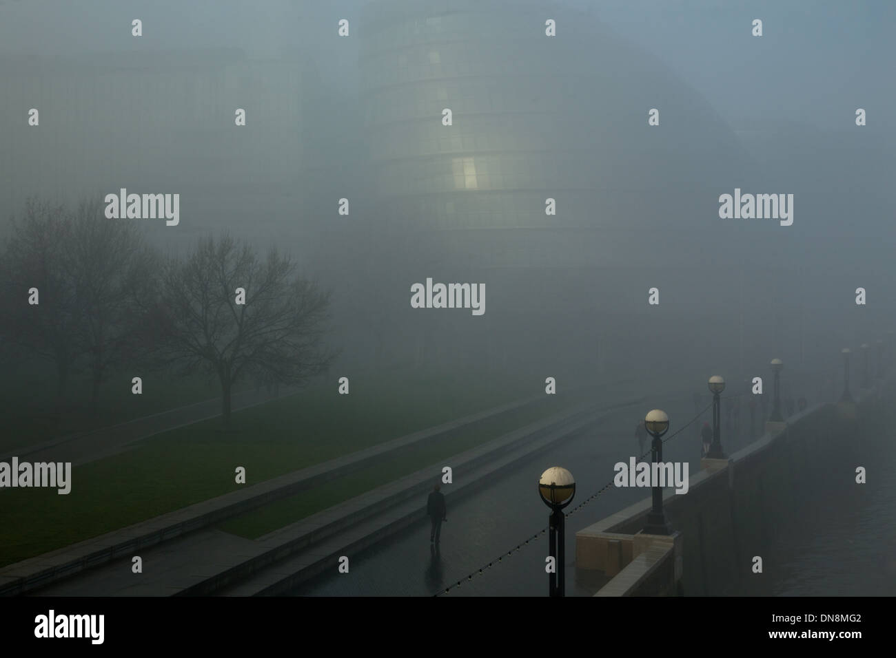 Sunshine through fog reflects off the glass of London's City Hall as ...