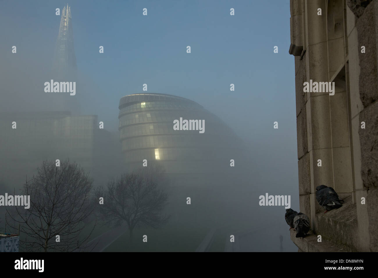 Sunshine through mist reflects through mist off the glass of London's ...