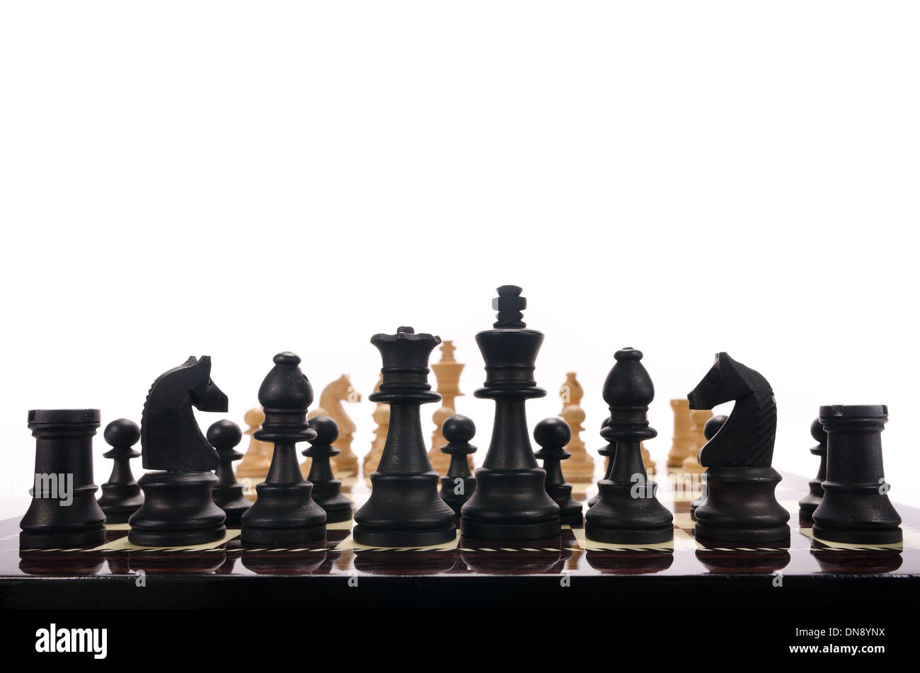 traditional wooden chess pieces on chessboard in different positions ...