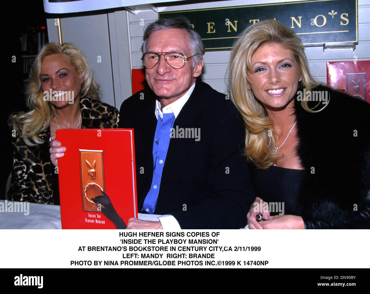 Feb. 11, 1999 - K14740NP 02/11/99.HUGH HEFNER SIGNS COPIES OF.''INSIDE ...