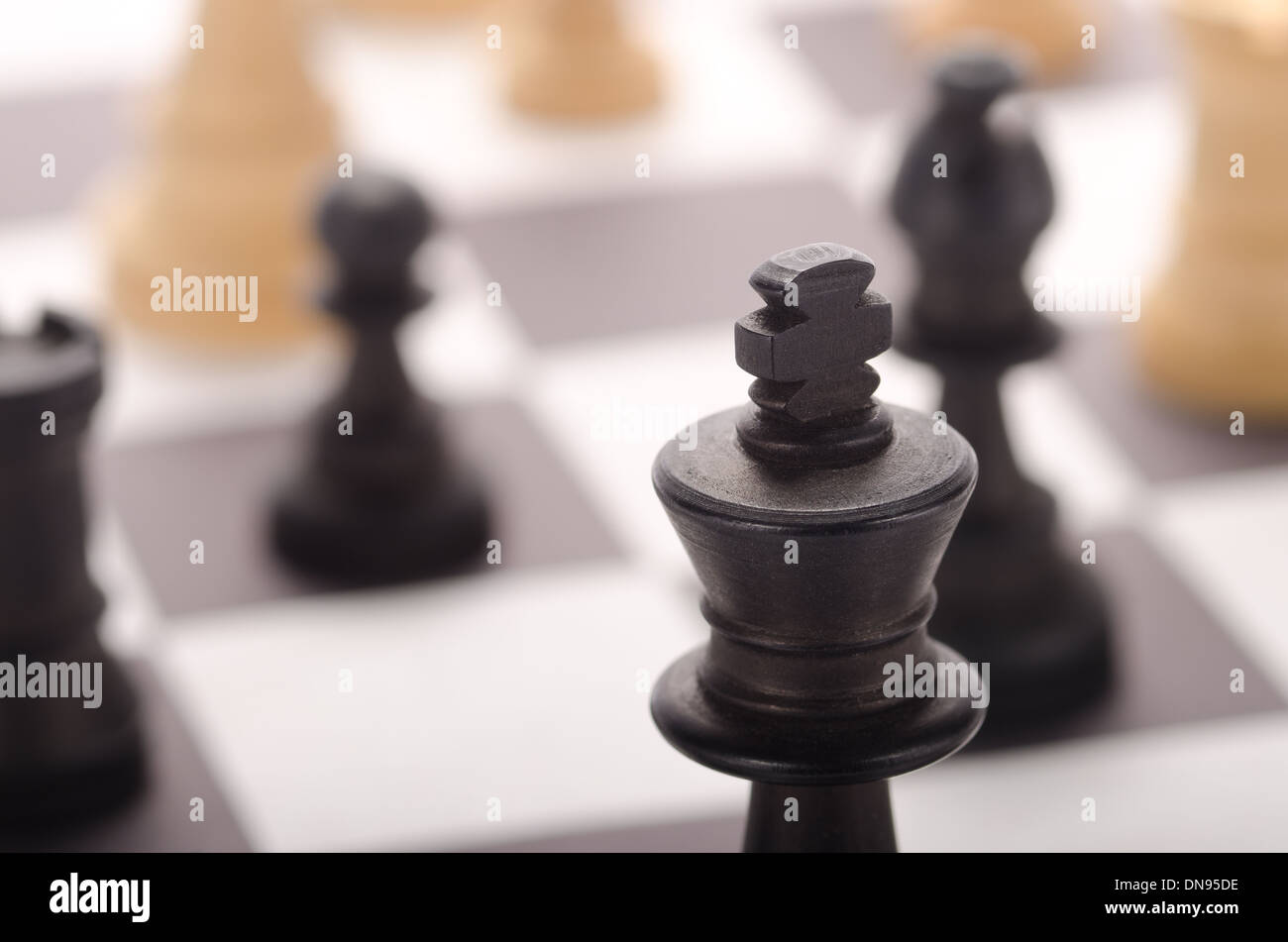 traditional wooden chess pieces on chessboard in different positions ...