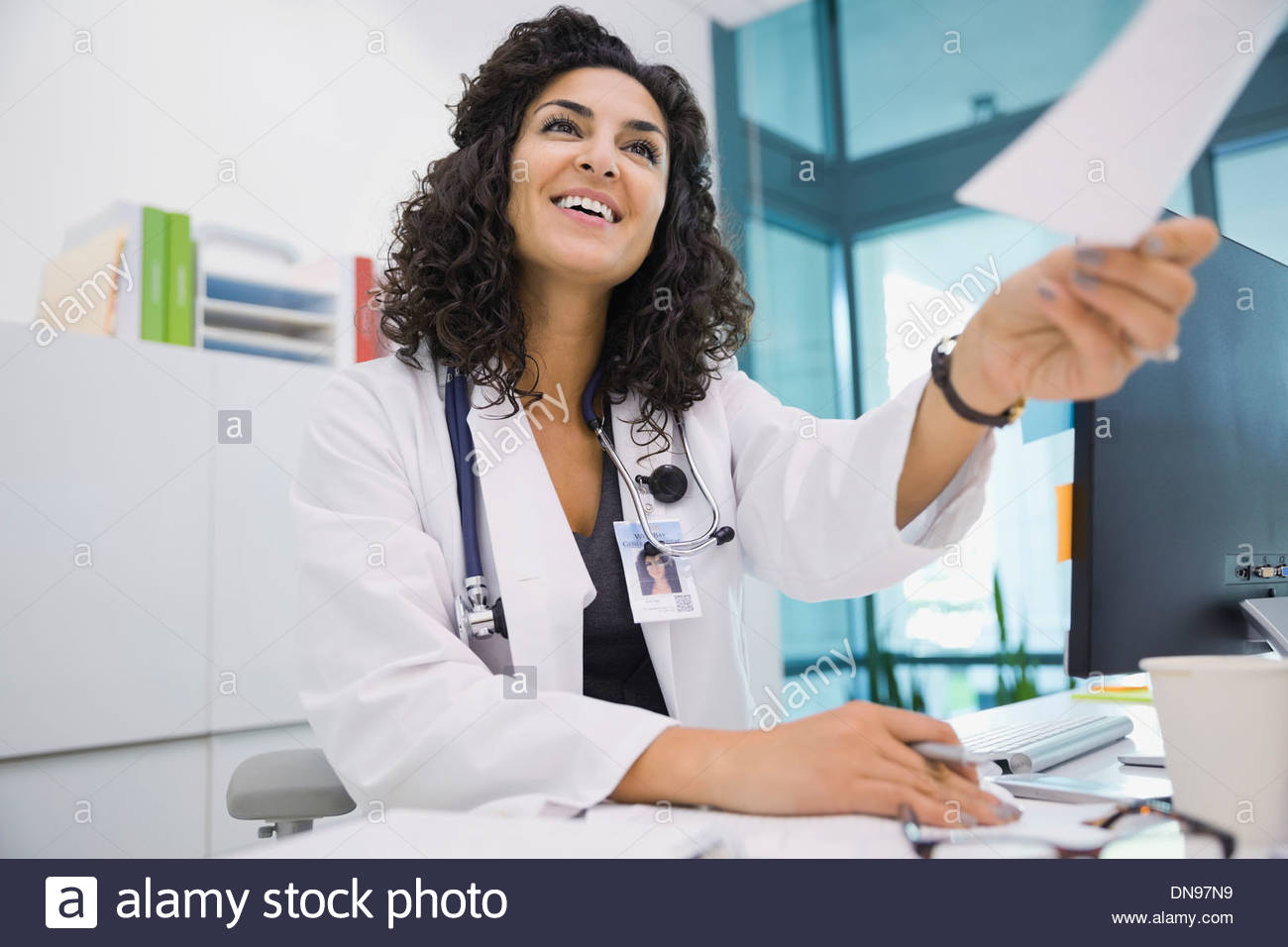 Female doctor handing over prescription hi-res stock photography and ...