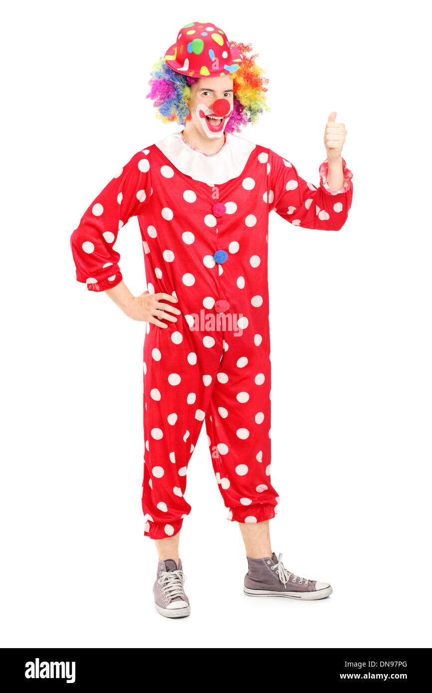 Full length portrait of a smiling happy clown in red costume giving ...