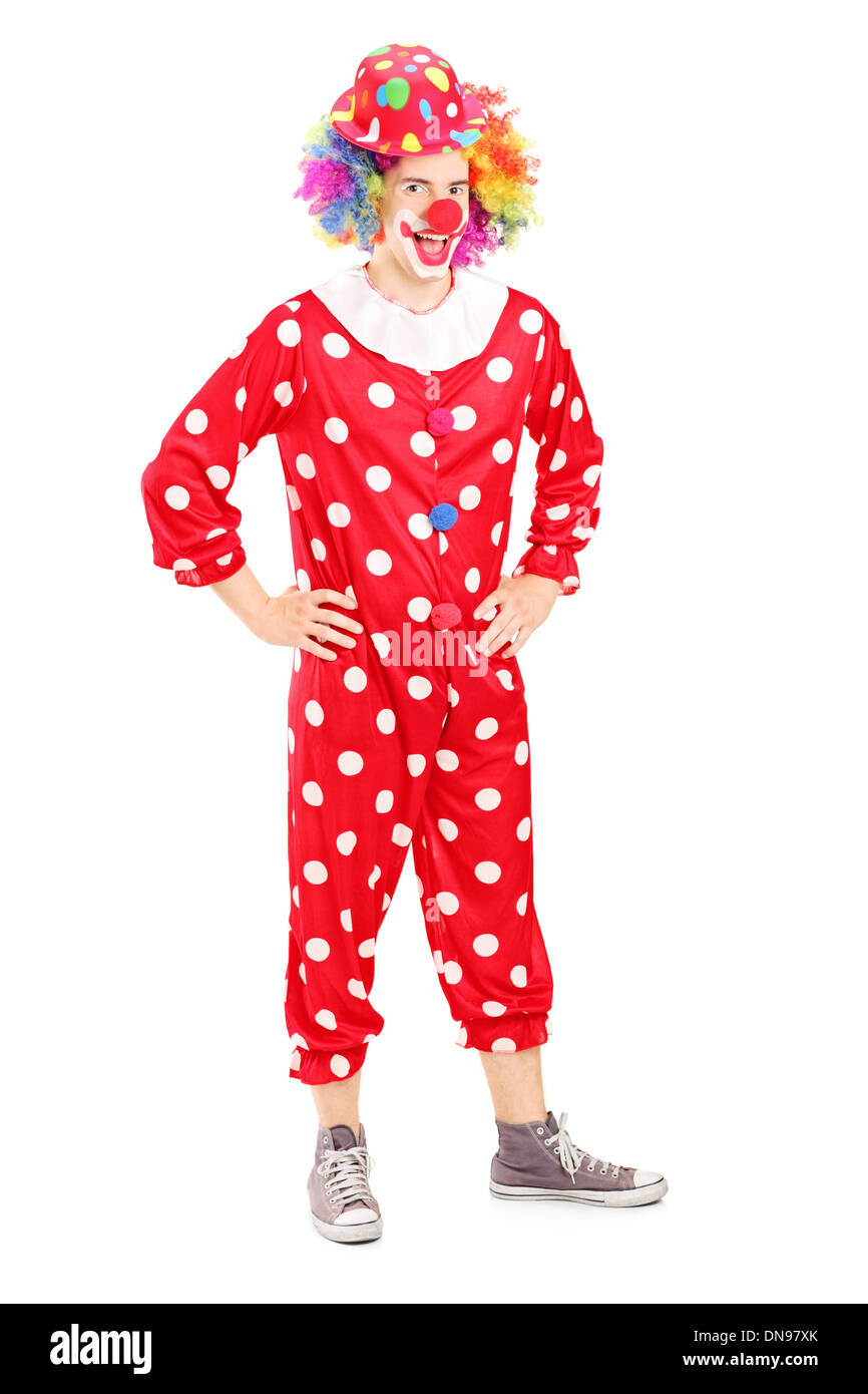 Full length portrait of a smiling happy clown in red costume posing ...
