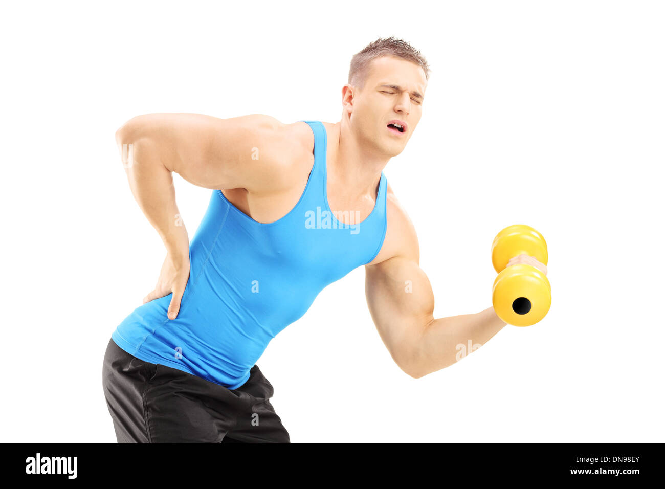 Young male athlete with back pain lifting a dumbbell Stock Photo - Alamy