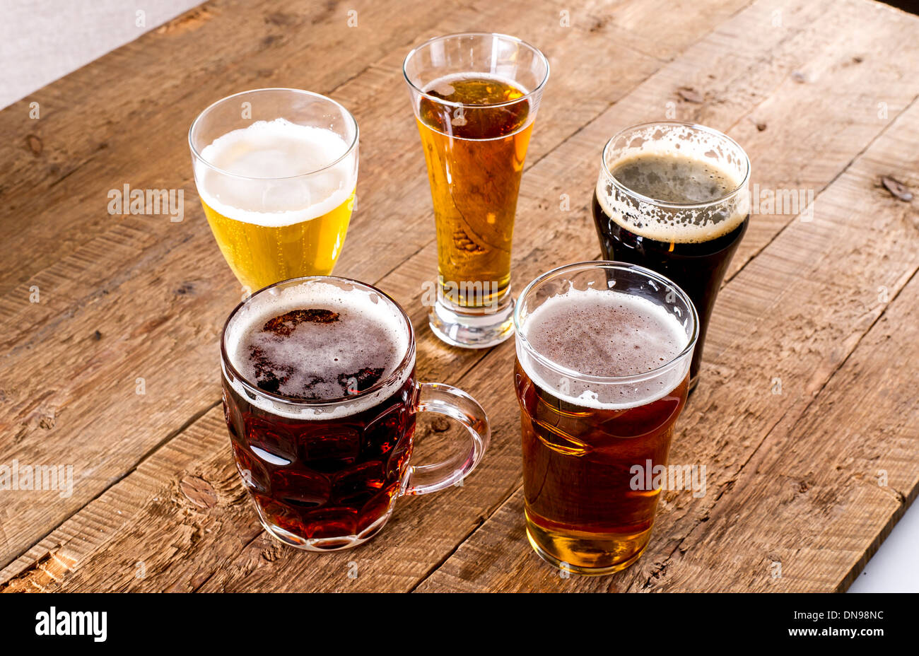Pints of ale and beer in glasses on a table, UK Stock Photo - Alamy