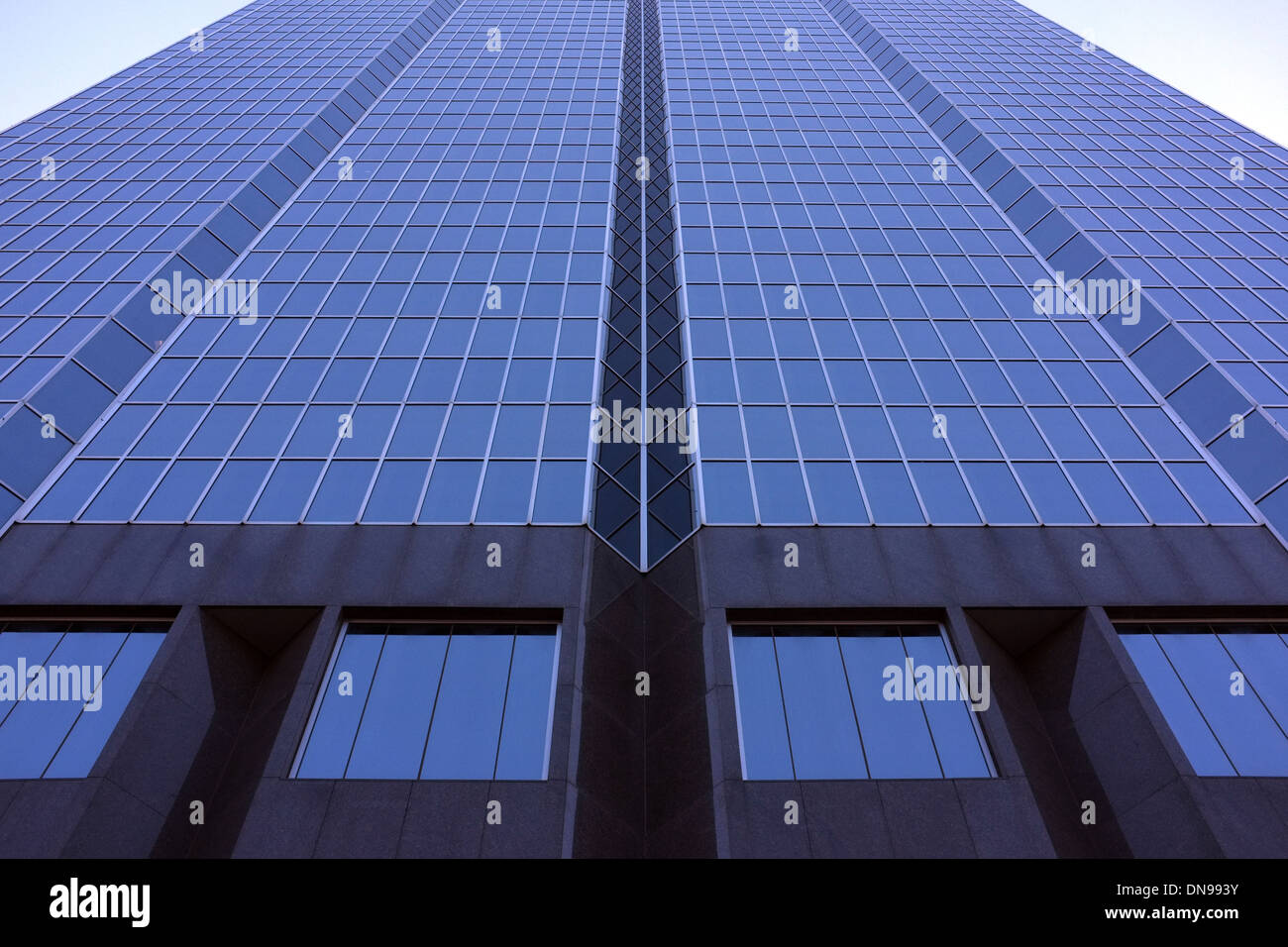 Looking up the side of a blue glass skyscraper Stock Photo - Alamy