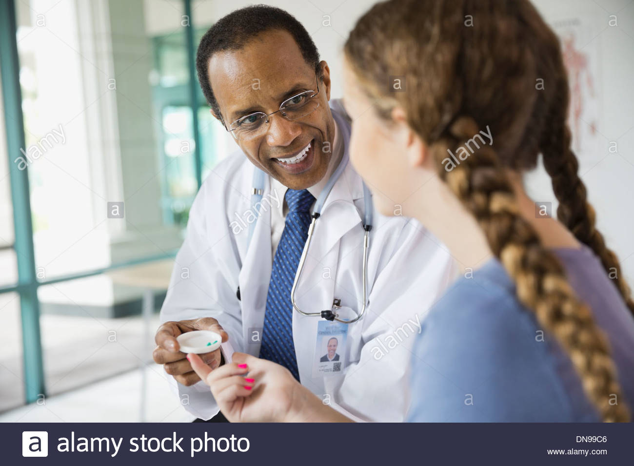 Doctor giving prescription hi-res stock photography and images - Alamy
