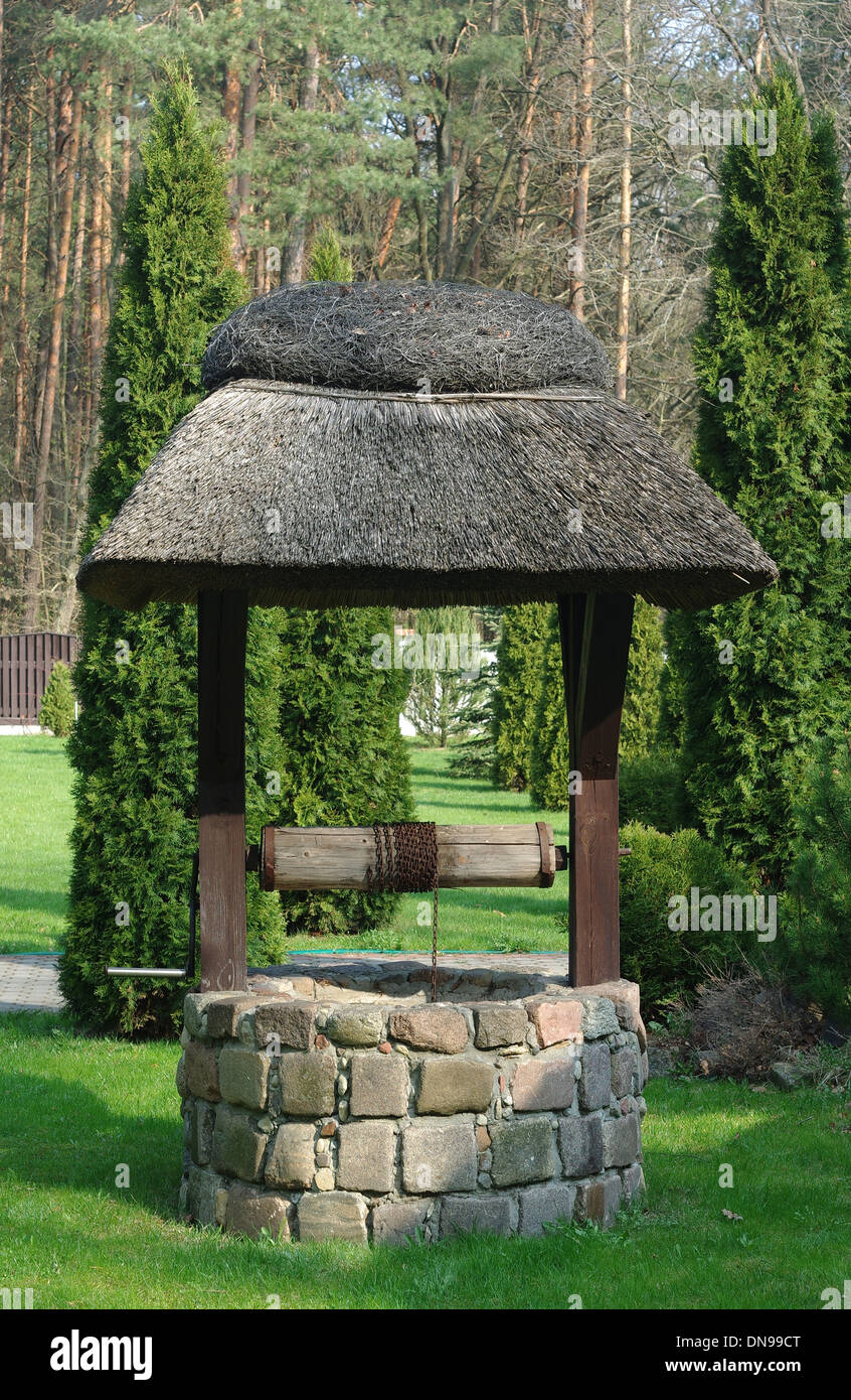 old well on a forest background Stock Photo - Alamy