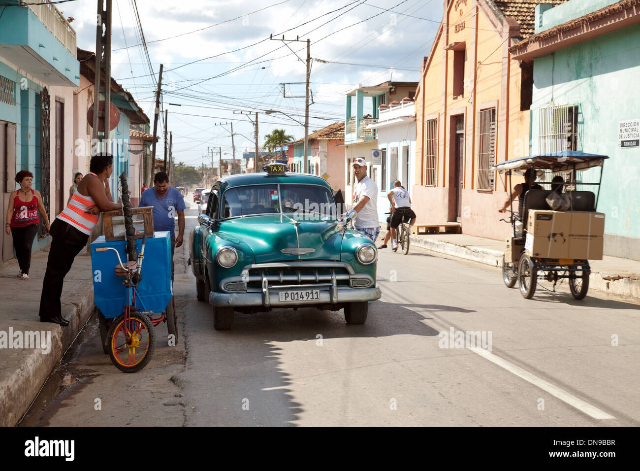 Typical street scene with car and local people, Trinidad, Cuba ...