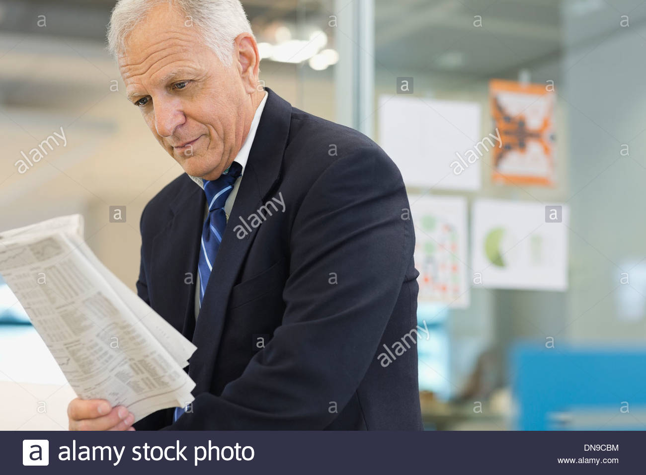 Reading newspaper serious business hi-res stock photography and images ...