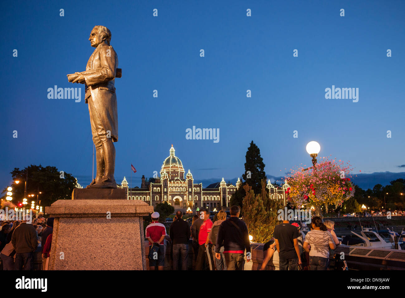 Statue of Captain James Cook at Victoria Inner harbour at twilight ...