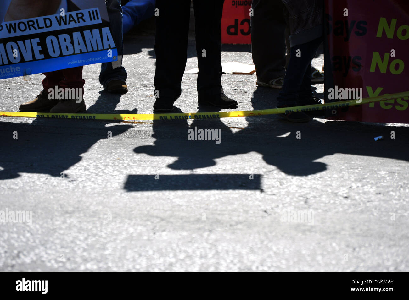 The shadows of a crowd of protesters holding signs and banners Stock ...