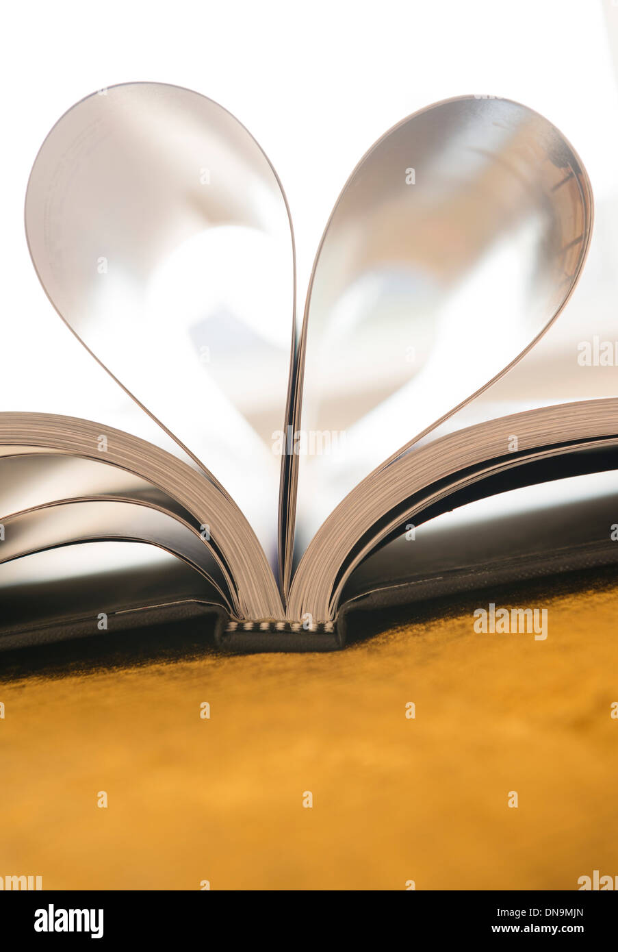 Pages of a book shaped like a heart Stock Photo - Alamy