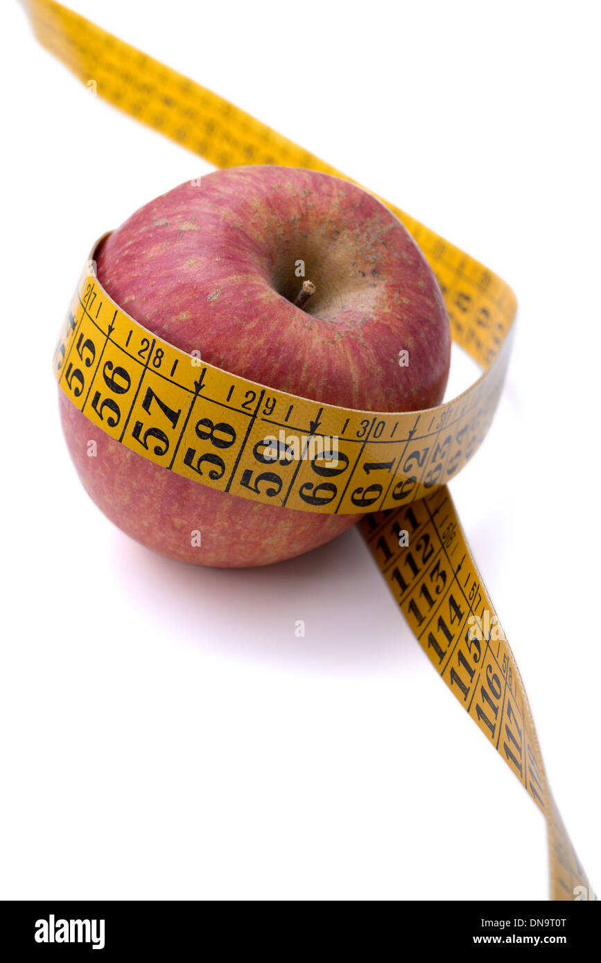 apple with tape measure. white background Stock Photo - Alamy