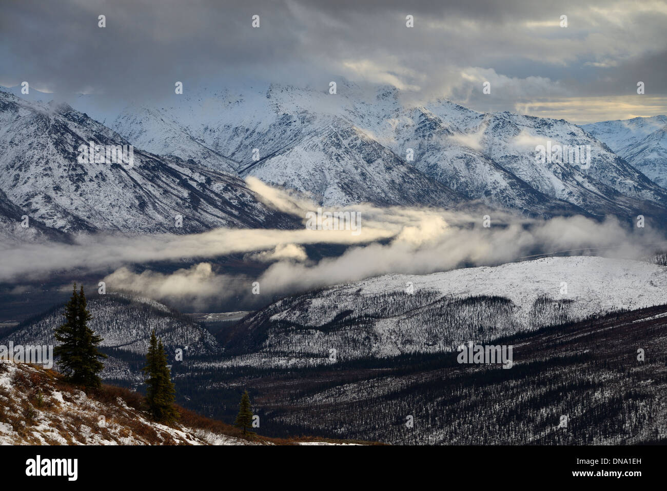 Sun and low clouds over Middle Fork Koyakuk river valley separating ...