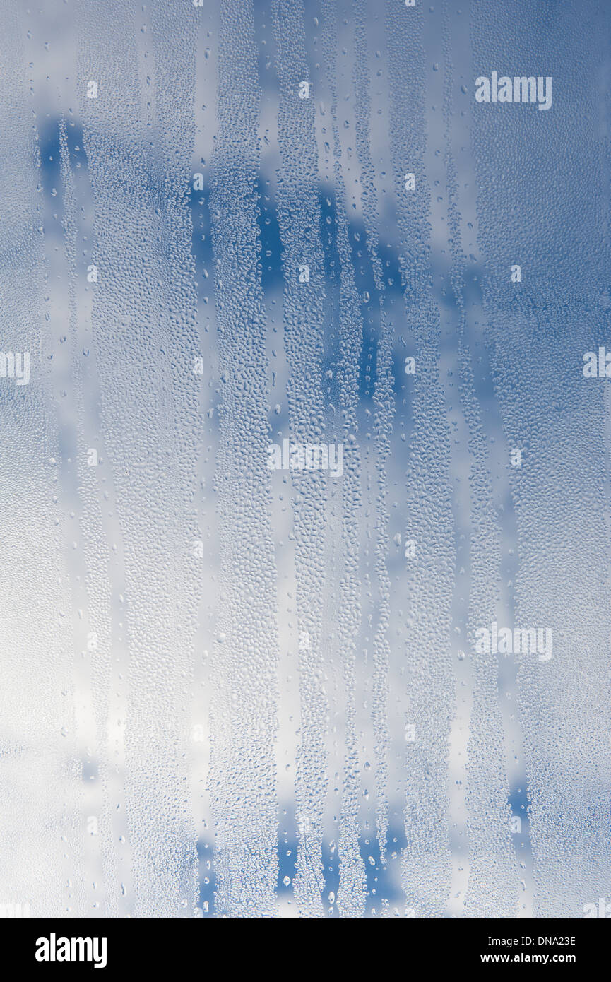 Condensation water drops flowing down on window Stock Photo - Alamy