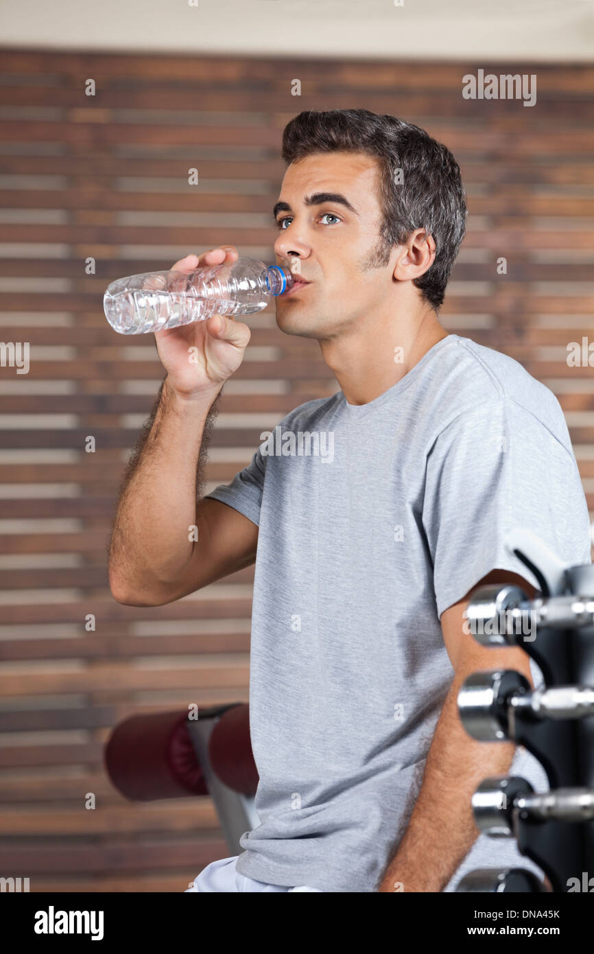 Man Drinking Water From Bottle At Health Club Stock Photo - Alamy