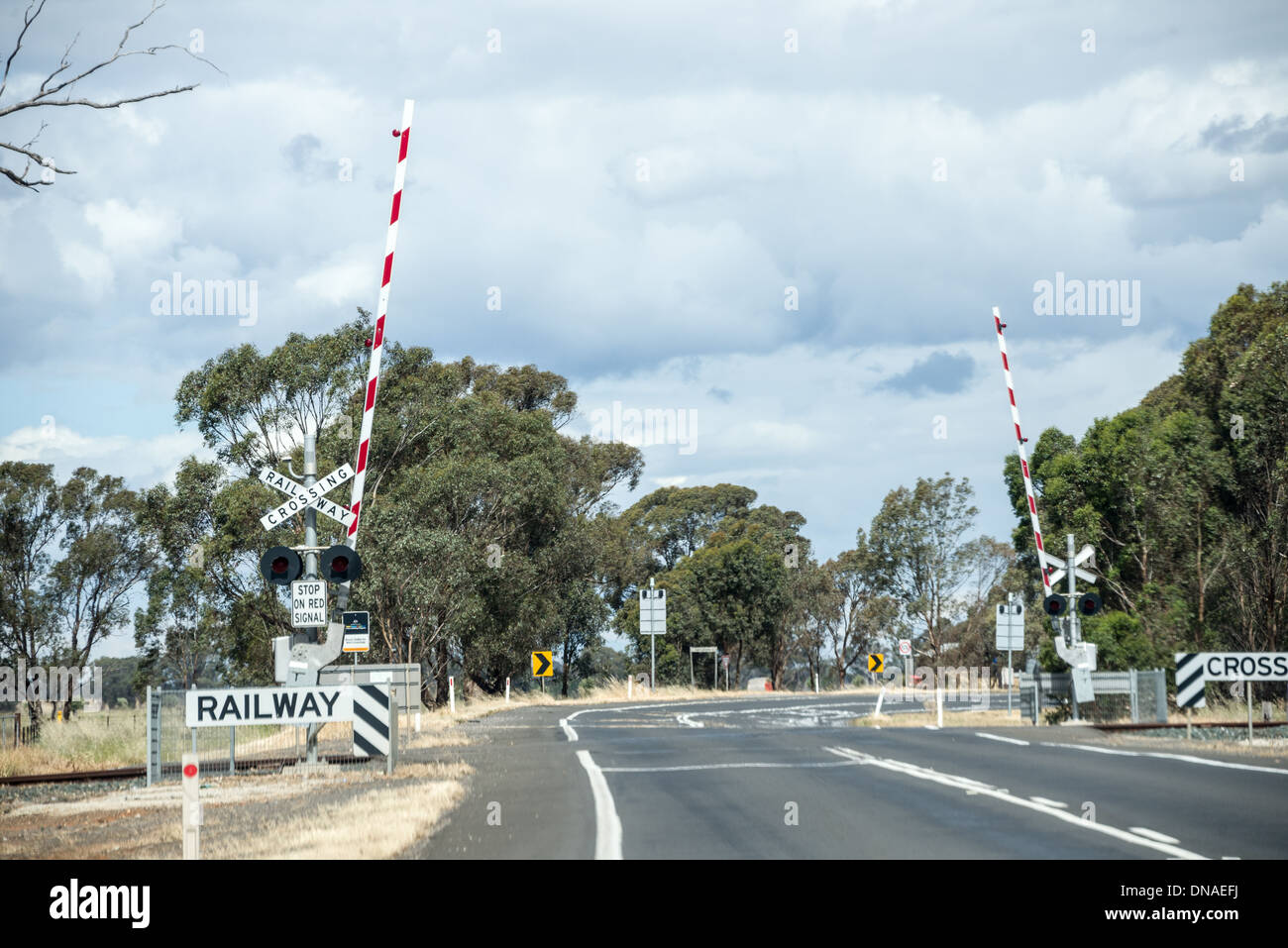 Country road railway crossing Stock Photo - Alamy
