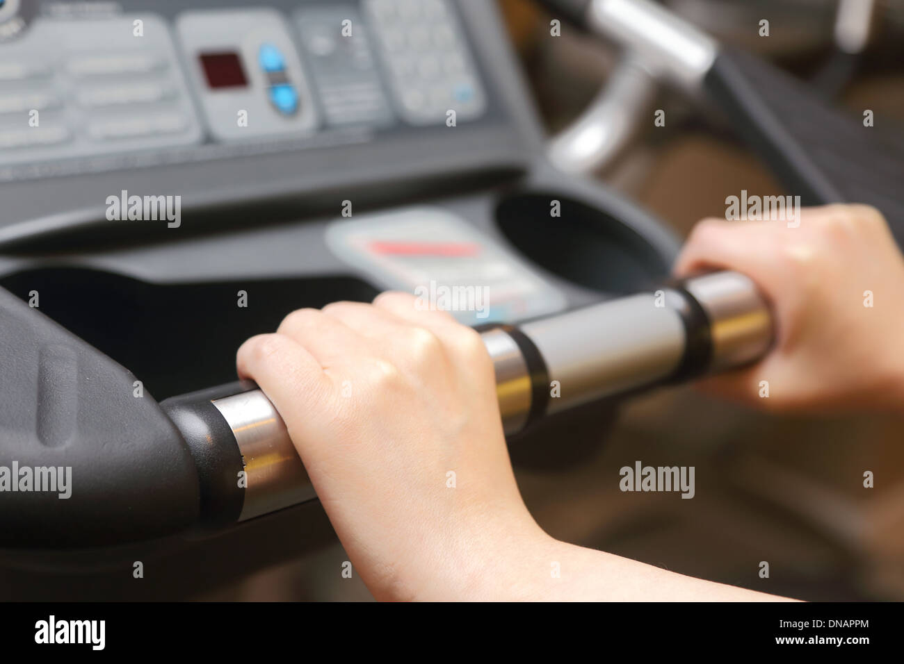 Woman on running machine Stock Photo - Alamy