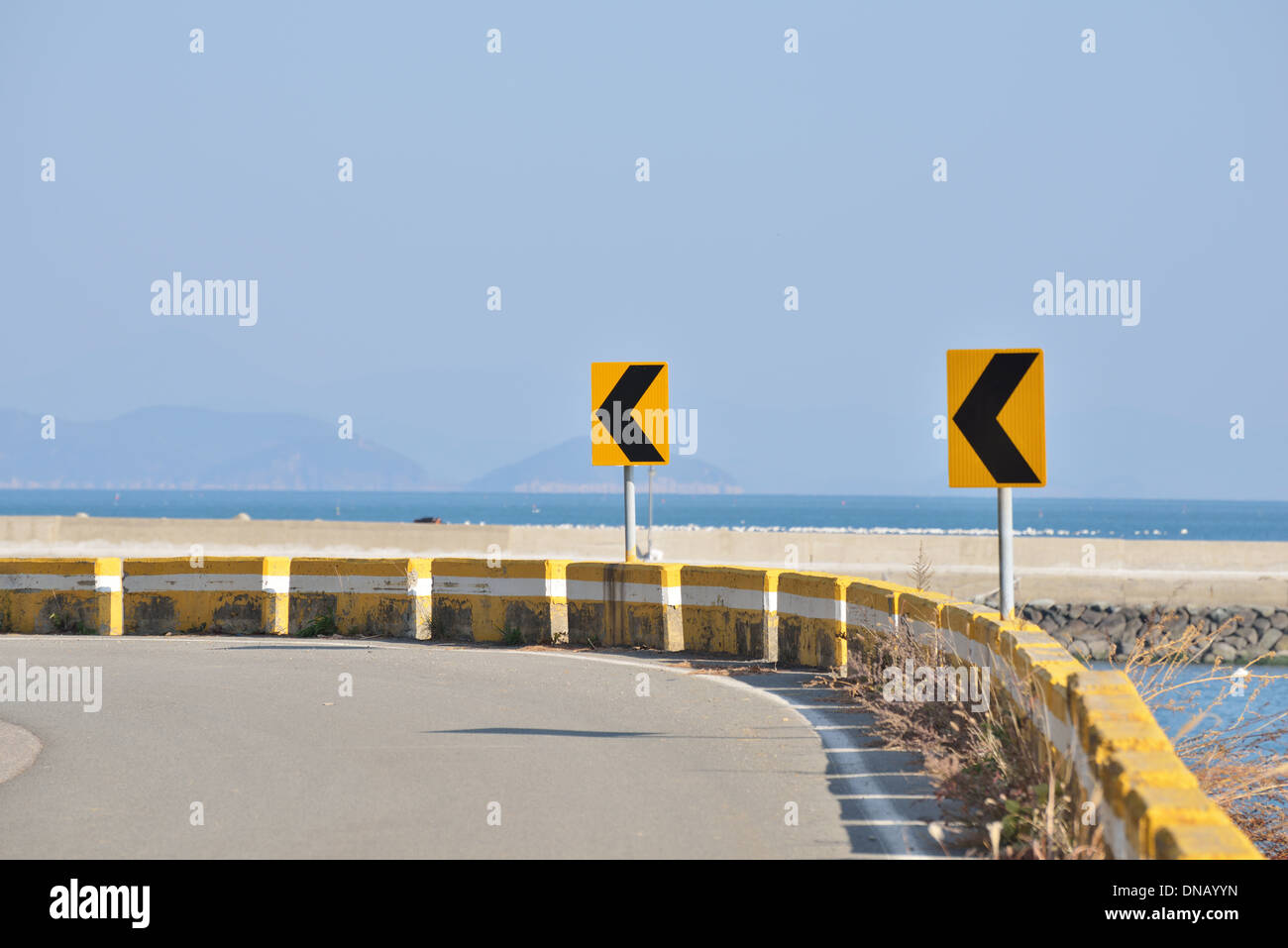 Curved left traffic road sign hi-res stock photography and images - Alamy