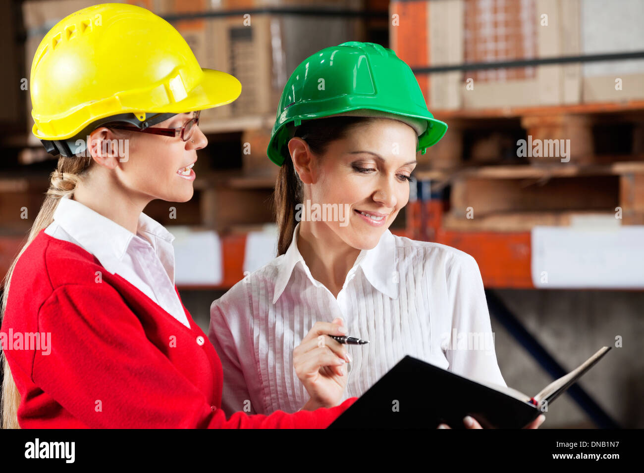 Female Supervisor And Colleague Working Together Stock Photo - Alamy