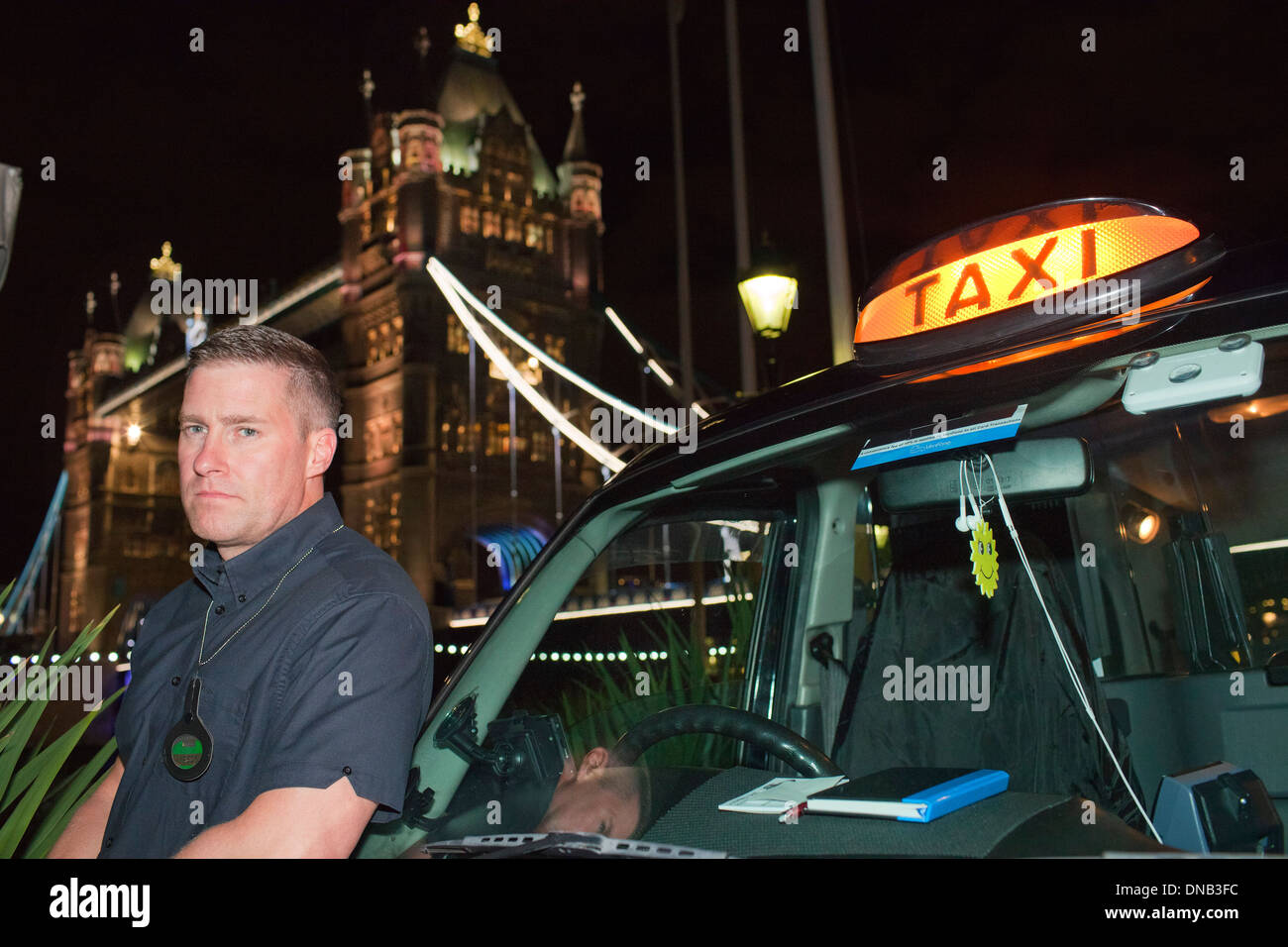 44 year old London born Taxi driver Lauren Harper with the cab he rents ...