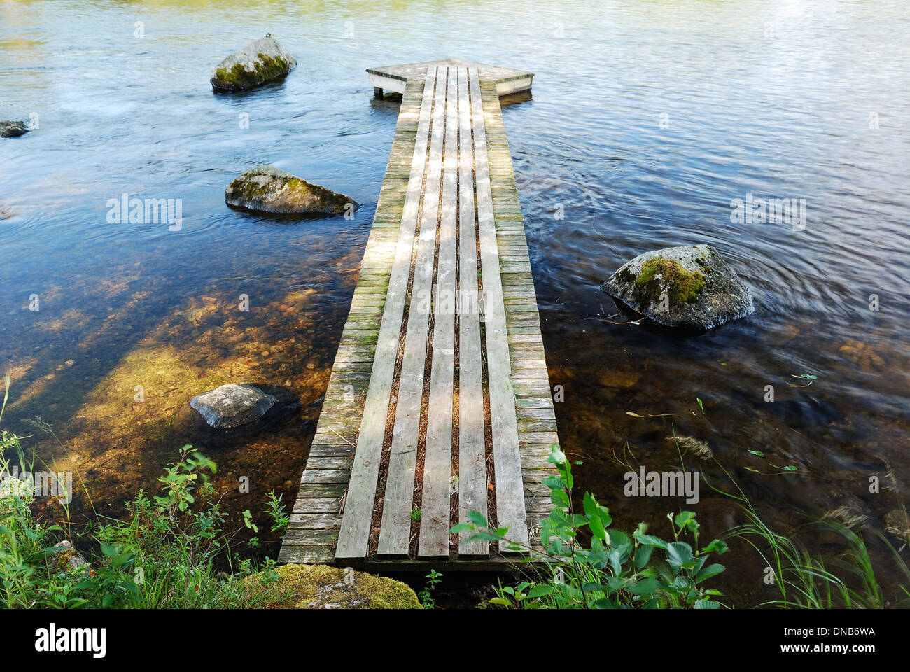 Wooden footway on the lake Stock Photo - Alamy