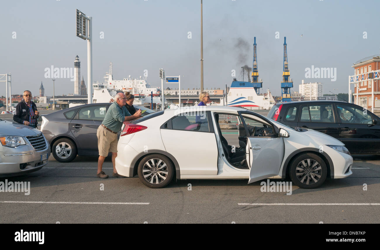 Motorists standing outside their cars in queue for Calais Dover Ferry ...