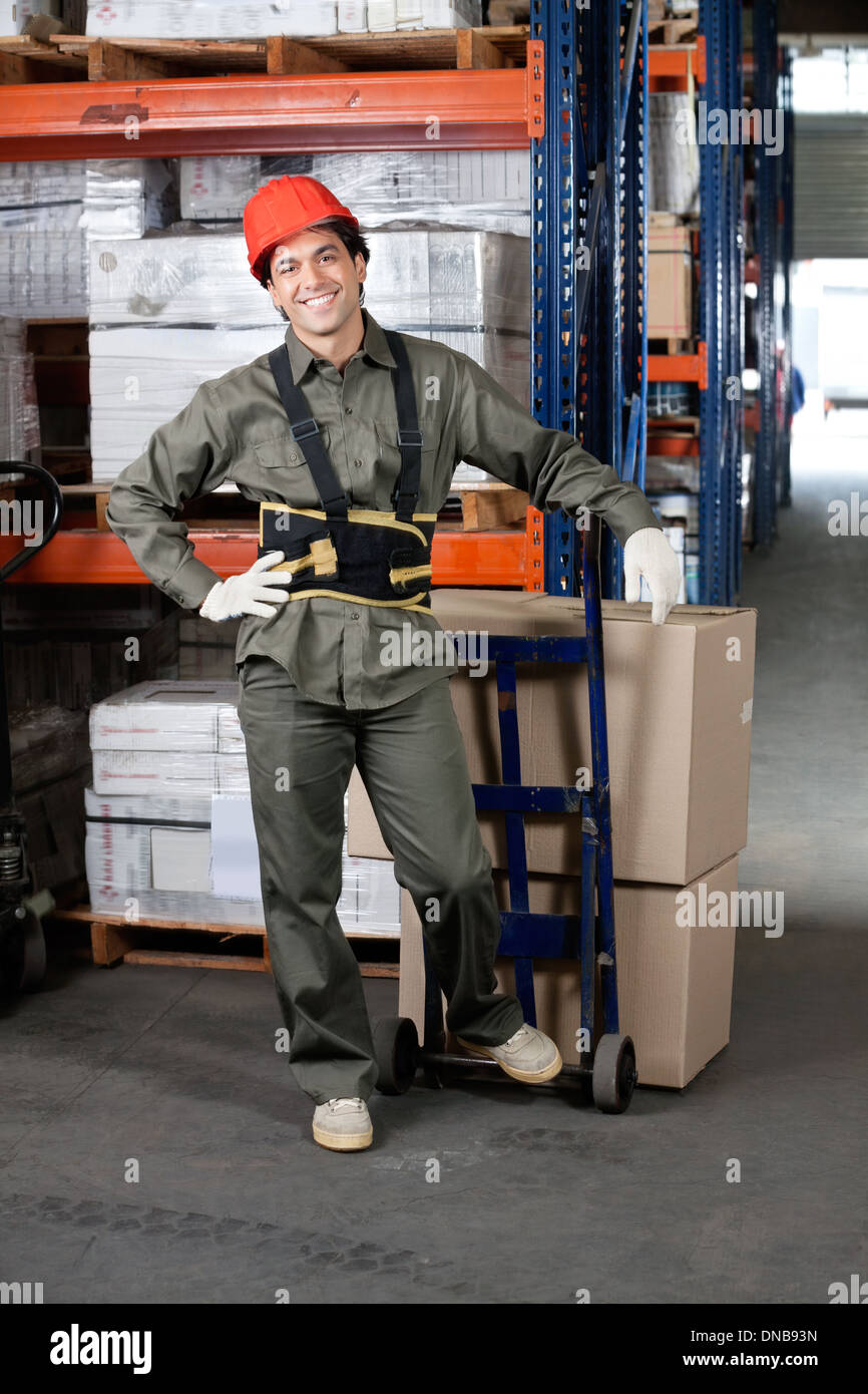 Foreman With Handtruck Loading Cardboard Boxes Stock Photo - Alamy