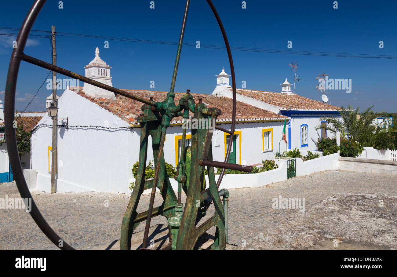 Fishermen's cottages and old iron waterwheel in Cacela Velha, The ...