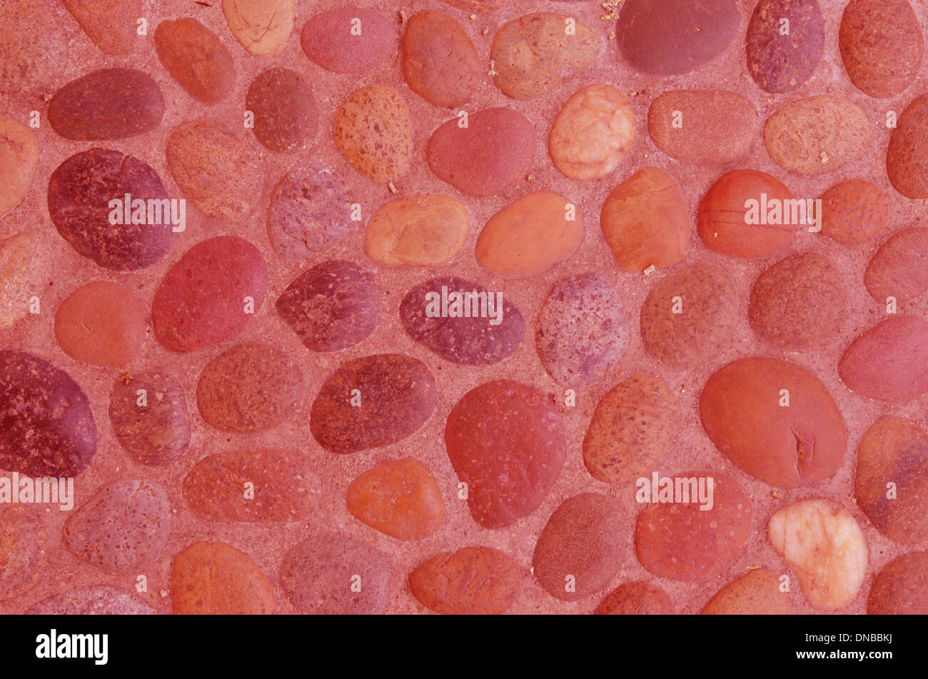 The decorative stone wall , red background texture Stock Photo - Alamy