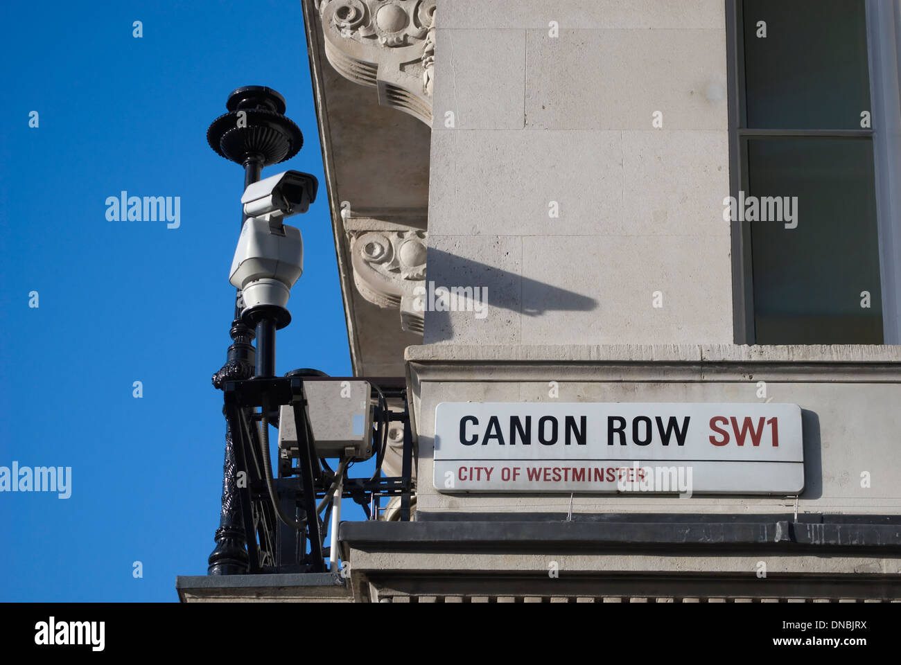 westminster street sign for canon row, london sw1, with cctv camera ...