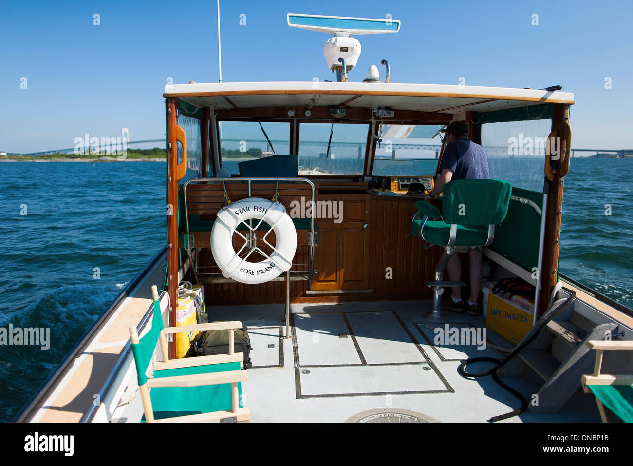 The launch that ferries guests to Rose Island lighthouse B&B close to ...