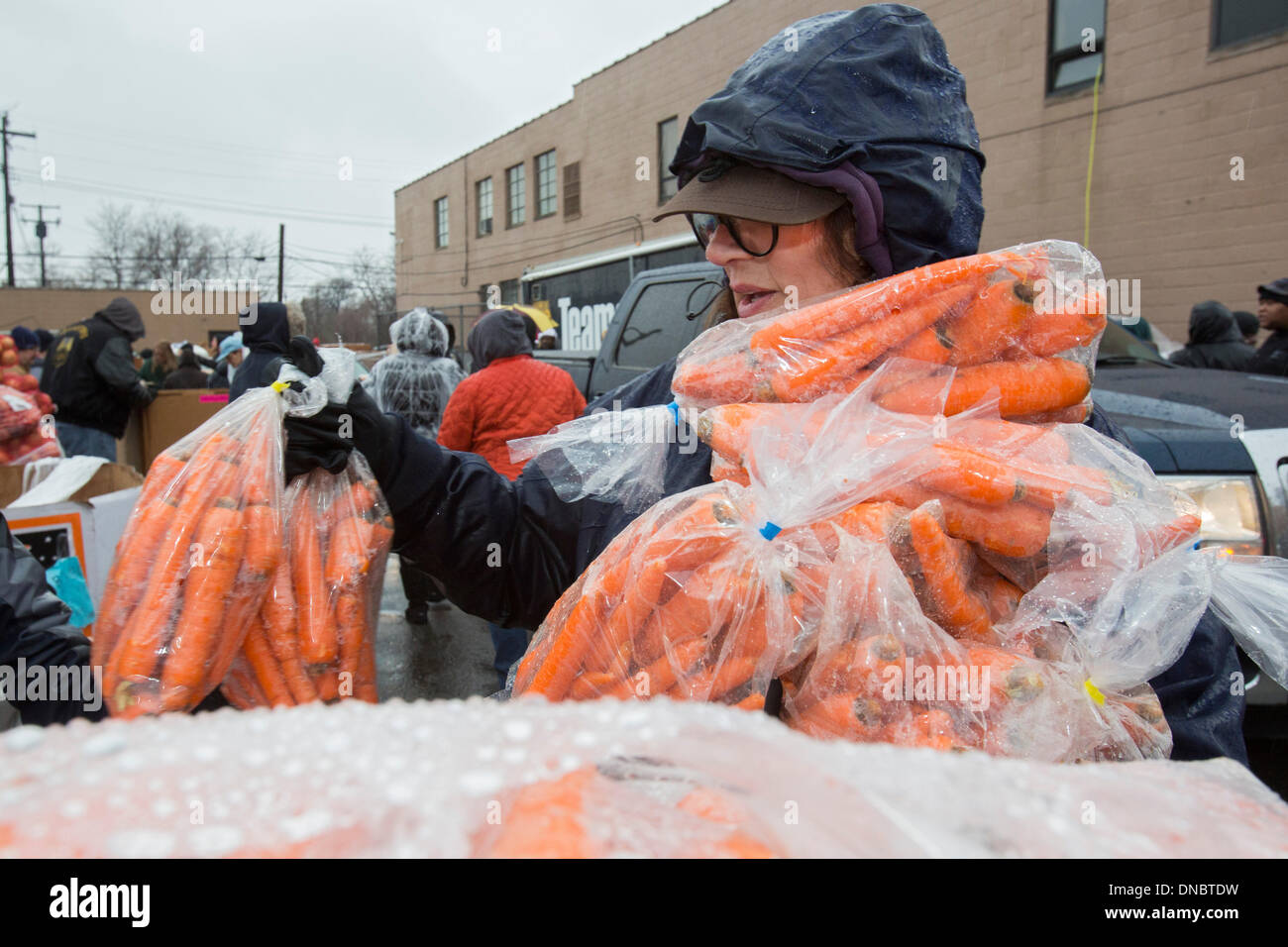 Detroit, Michigan, USA - In a cold rain, volunteers from local trade ...