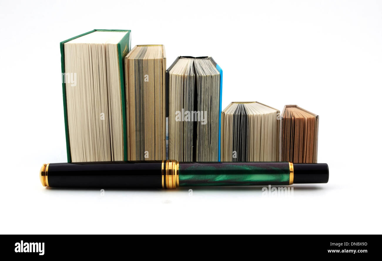 Mini books and pen Stock Photo - Alamy