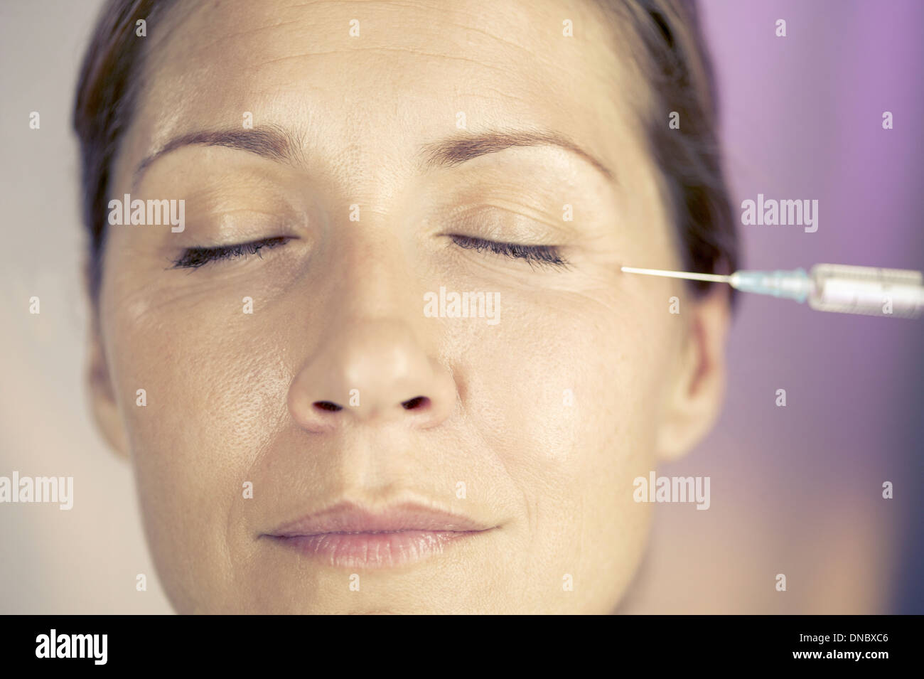 A middle aged woman having a Botox injection Stock Photo - Alamy