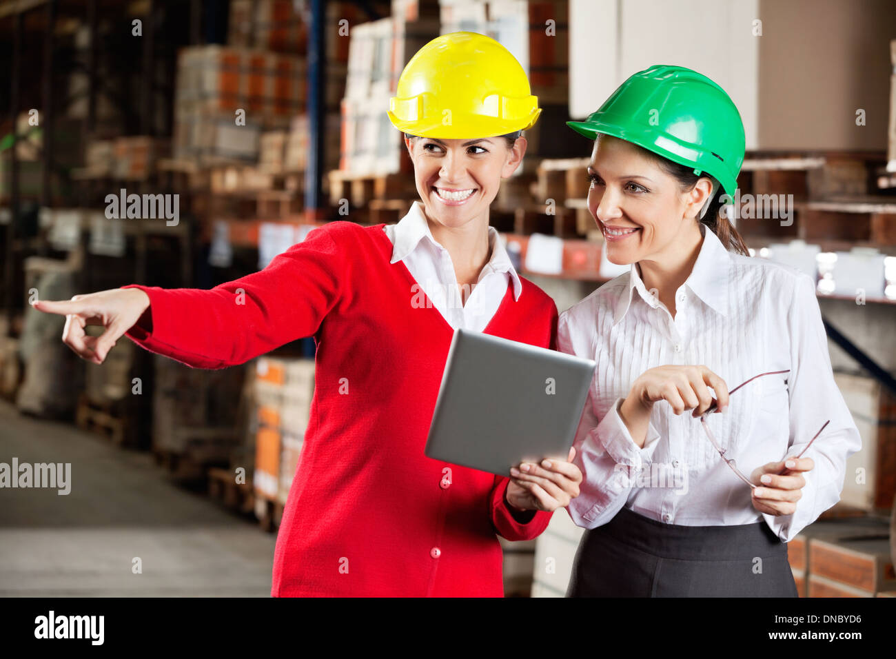 Female Supervisor With Colleague At Warehouse Stock Photo - Alamy