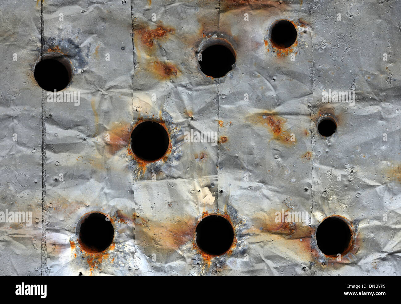 Old silver metal plate with bullet holes Stock Photo - Alamy