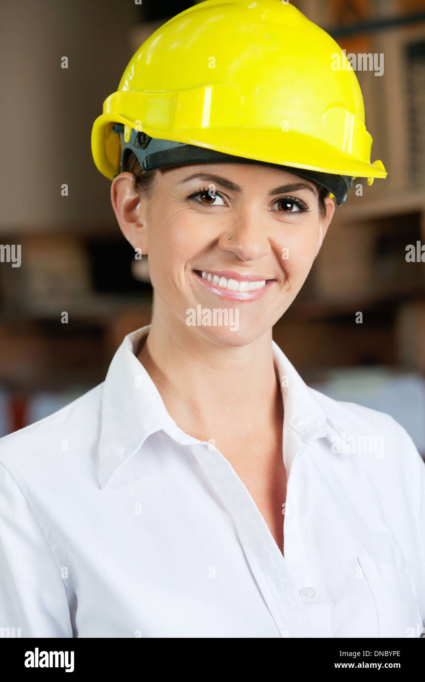Female Supervisor Wearing Hardhat At Warehouse Stock Photo - Alamy