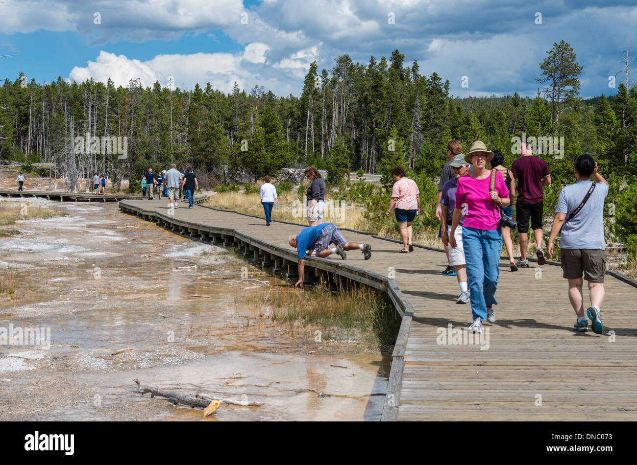 Visitors on the boardwalk at Fountain Paint Pot thermal area ...