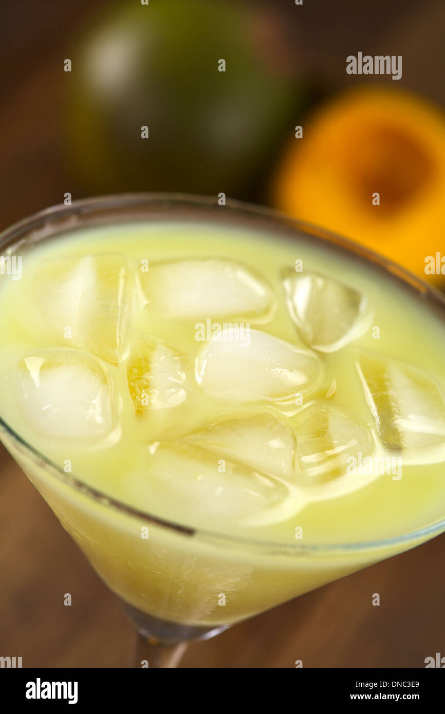 Peruvian cream liqueur made of lucuma fruit served in cocktail glass ...