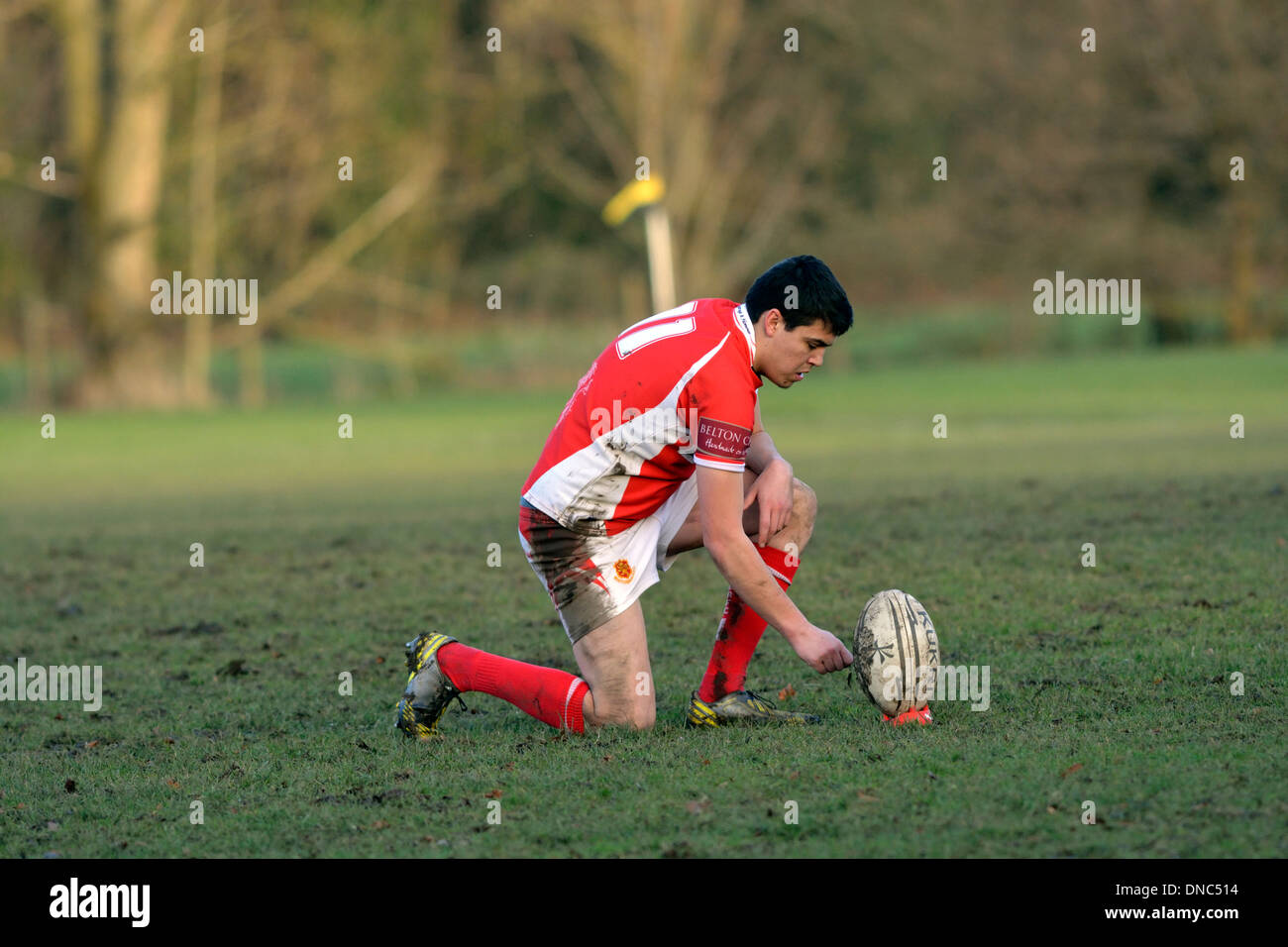 a birchfield rugby player carefully places the ball before attempting a ...