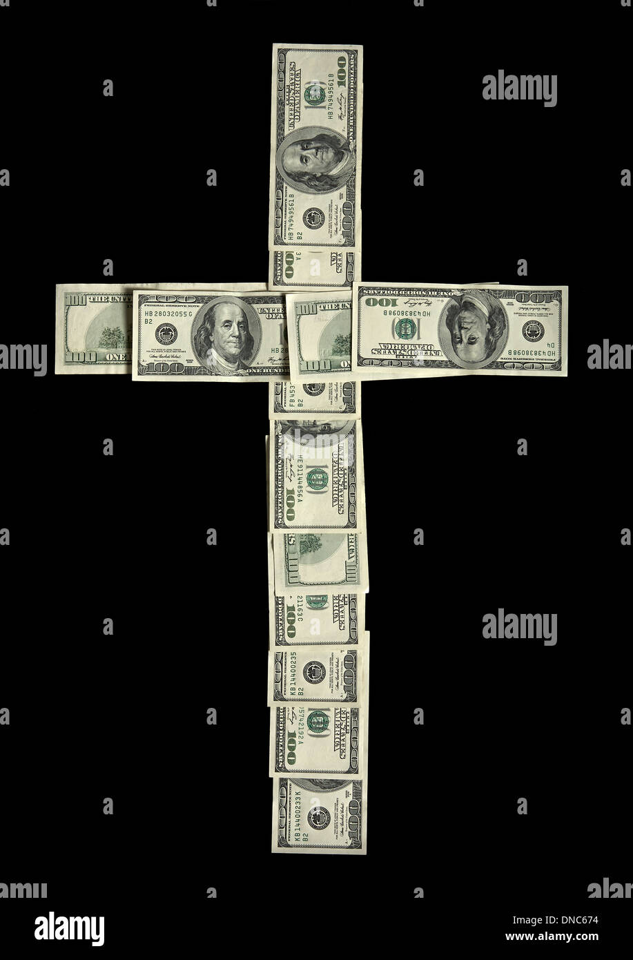 Cross from money Stock Photo - Alamy