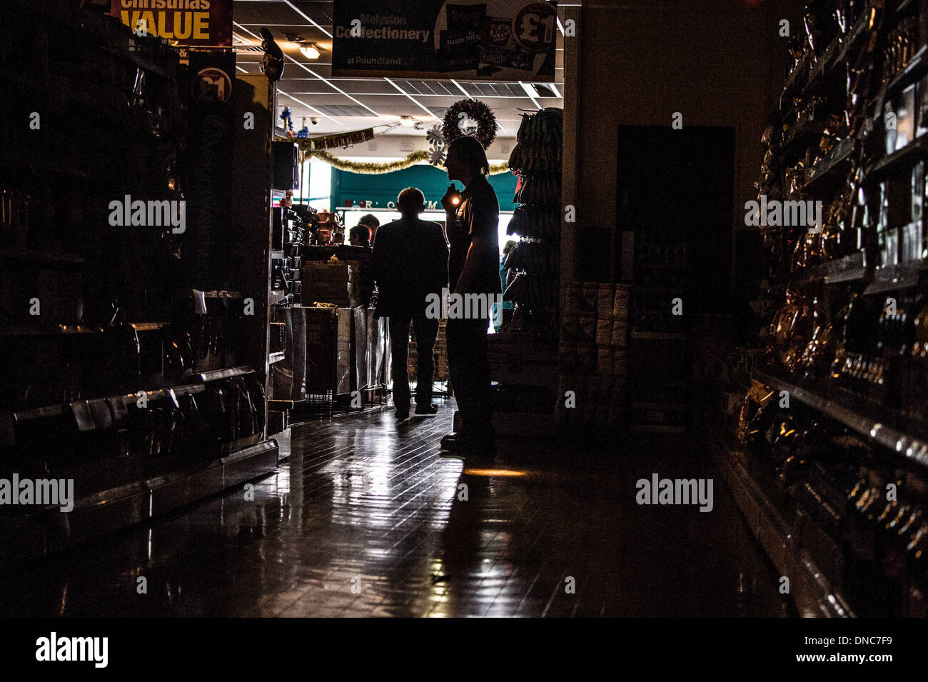 Aberystwyth Wales UK. 22nd Dec, 2013. People shopping by the light of ...